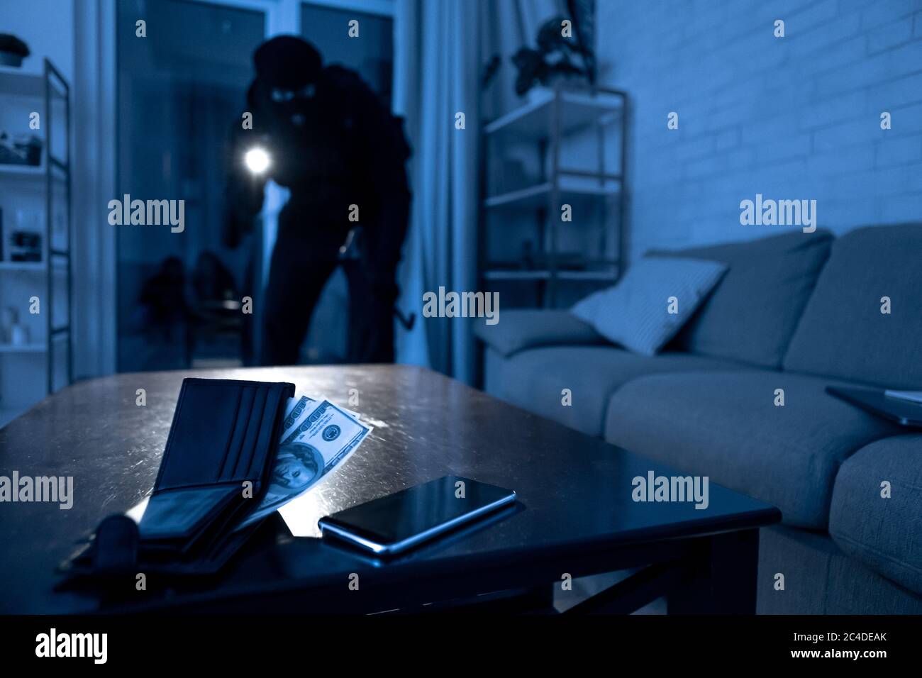 Intruder breaking in an apartment to steal something Stock Photo - Alamy