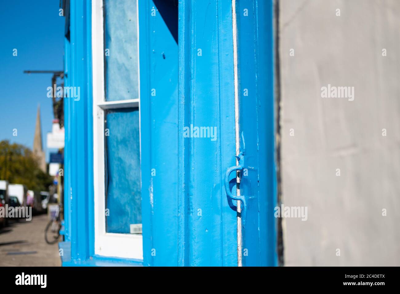 Freshly, blue painted front door and window frame seen on a terraced ...