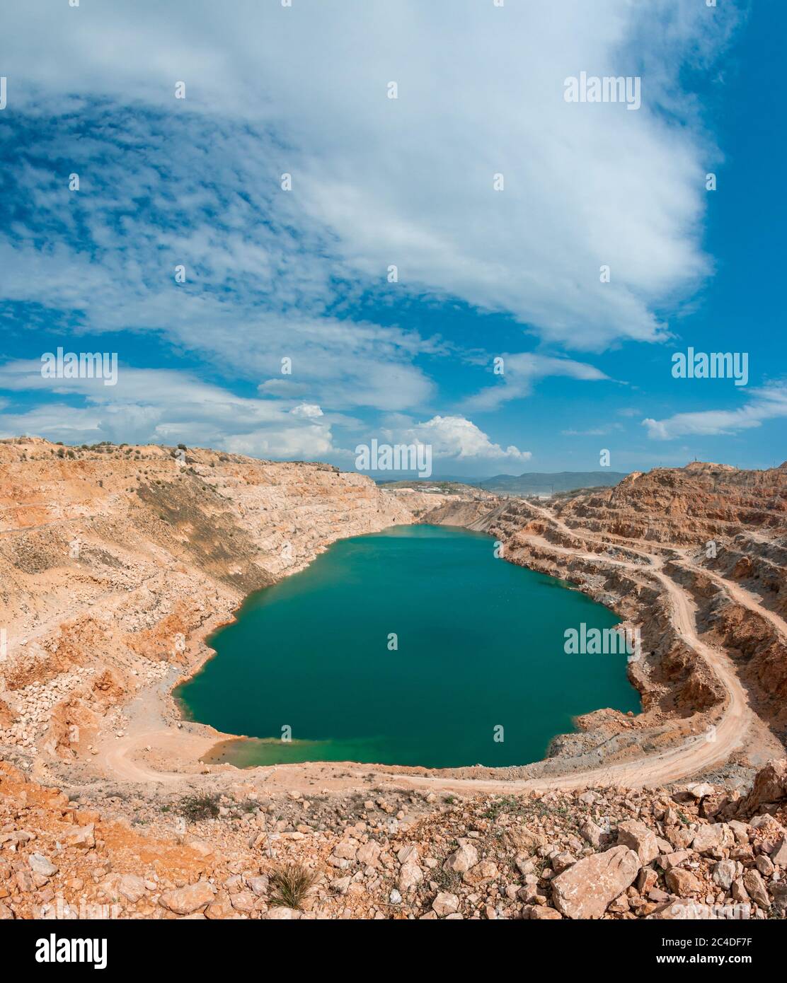 Emerald lake in a flooded quarry. Emerald green lake in flooded ...