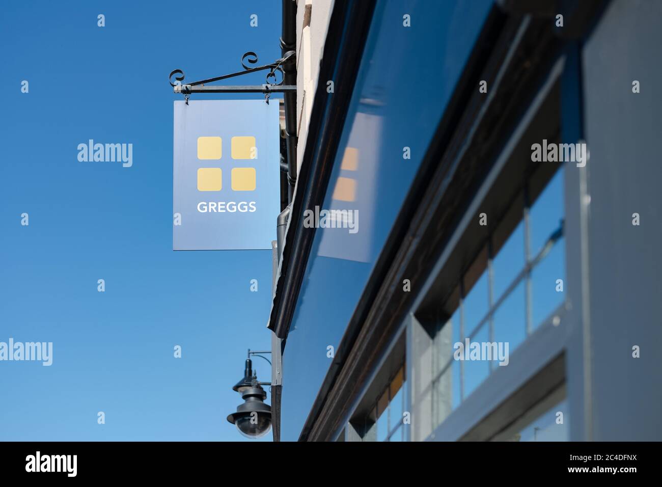 Isolated, popular UK high street food retail outlet showing its sign ...