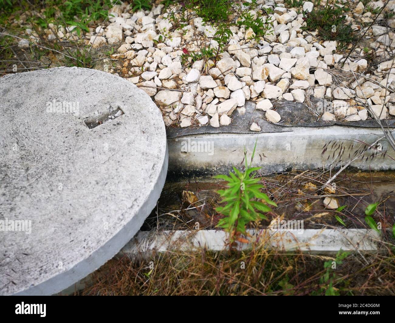 Shot of the concrete cover with limestone and canal in the side Stock ...