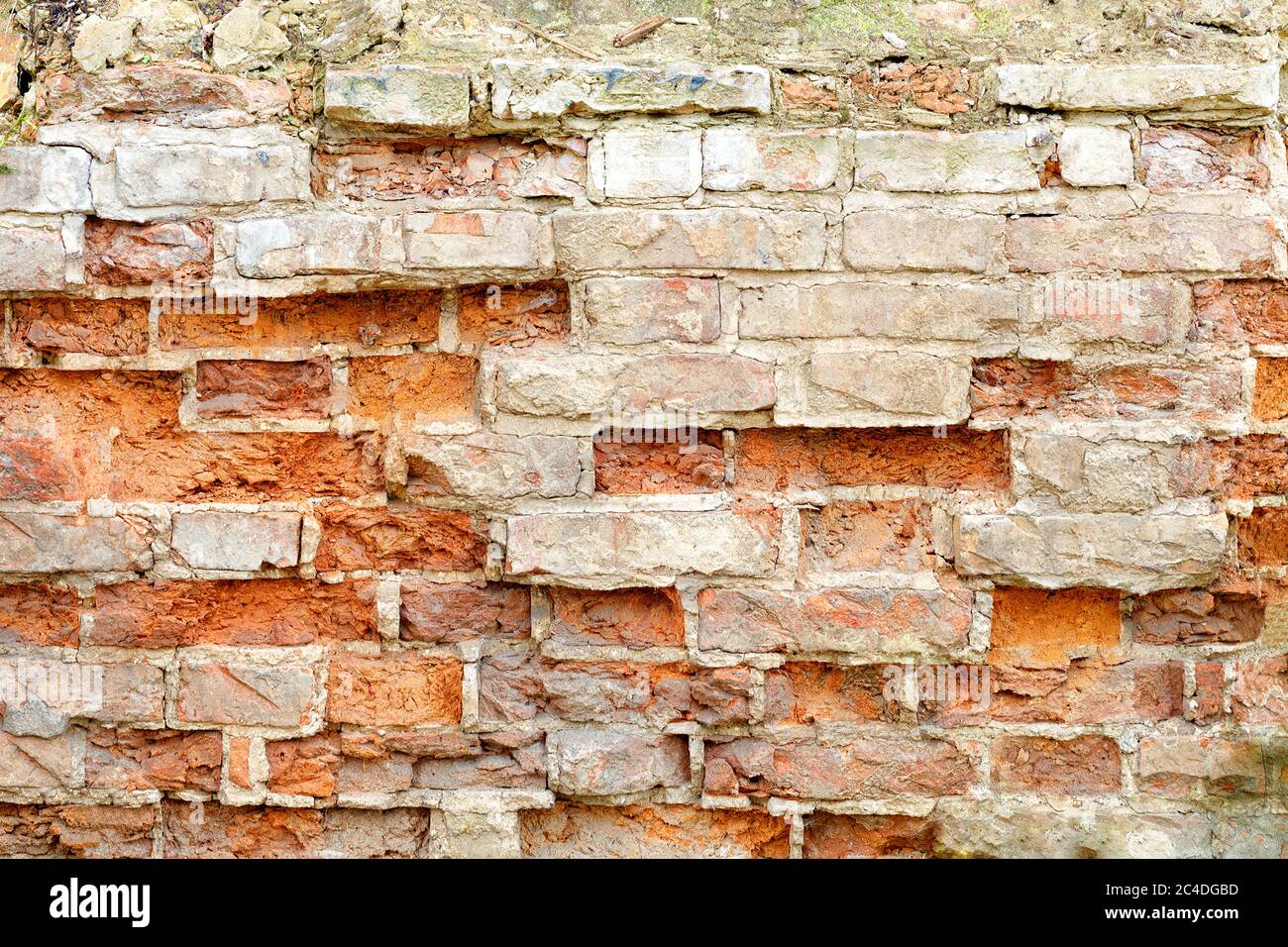 Old ruined red brick wall with cracked and broken bricks. Background ...