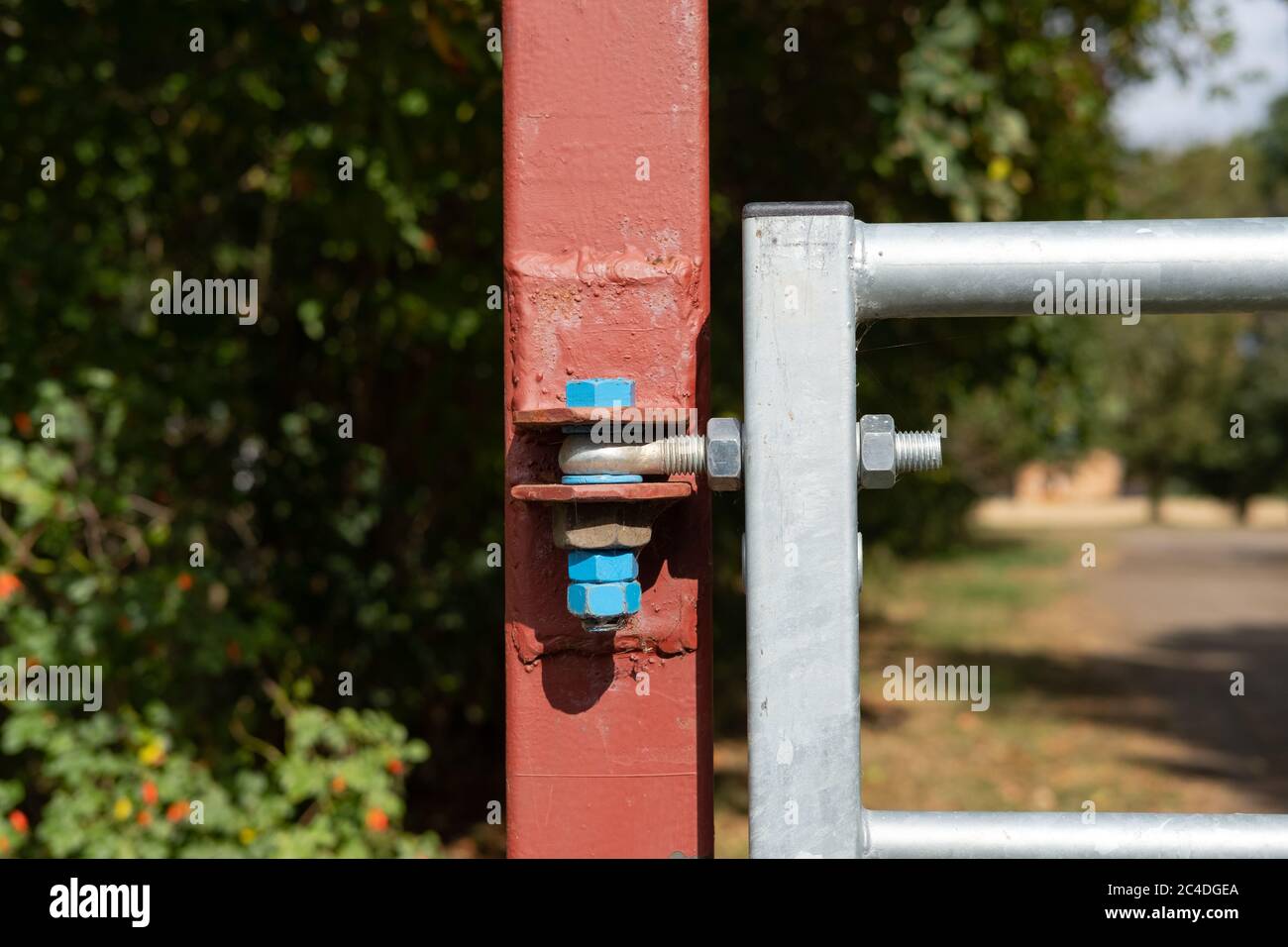 Isolated view of a newly installed metal gate post at the entrance to a ...
