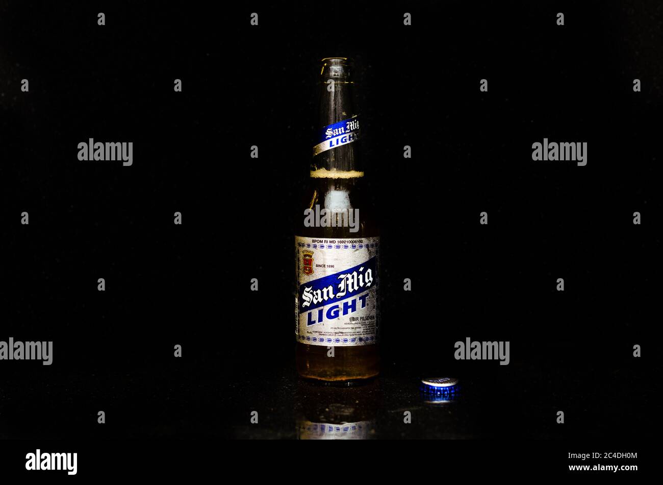 Front view of San Miguel Light beer with silver and blue label with the ...