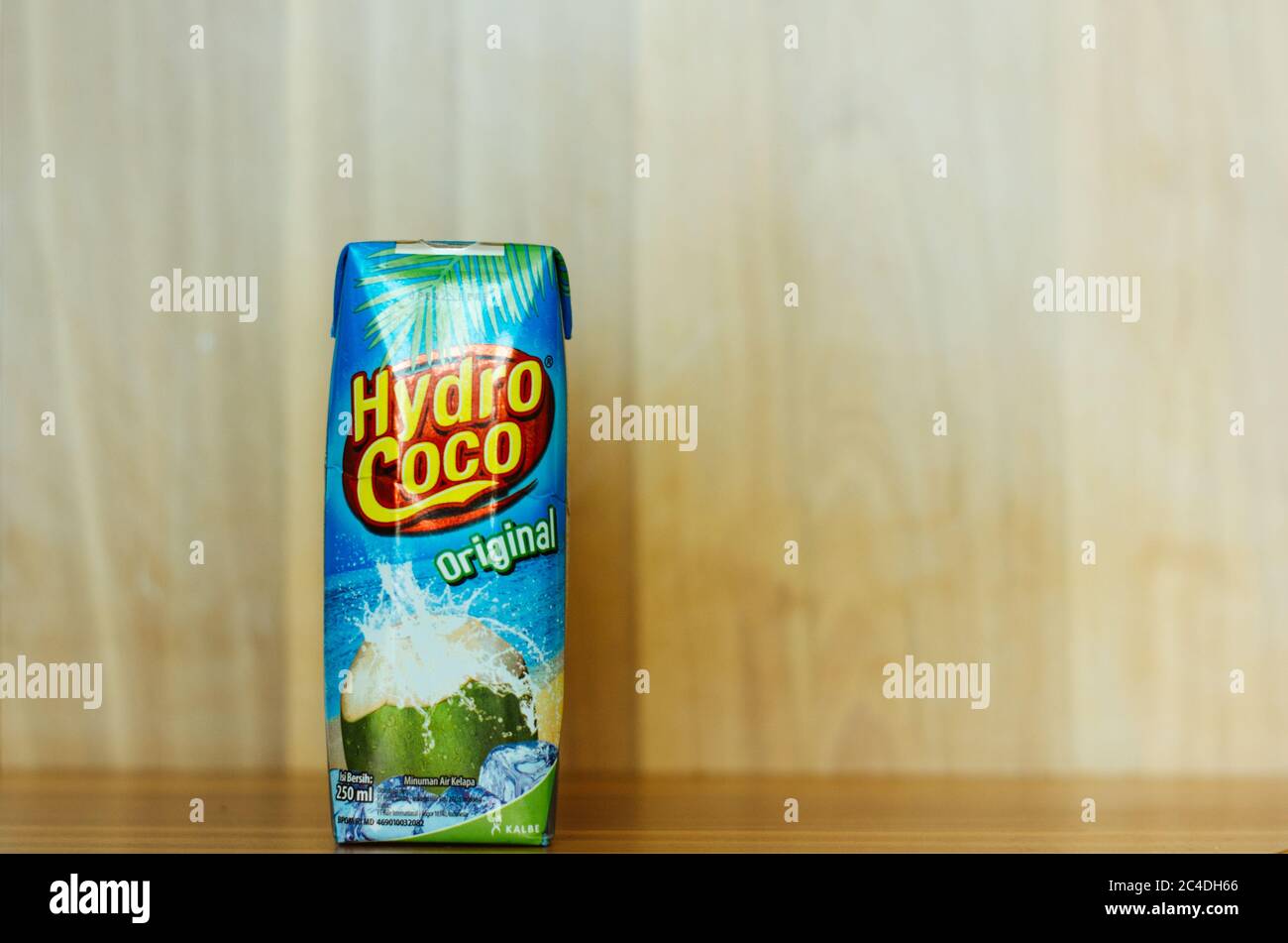 Close up of the Hydro Coco coconut water drink box in a wood background ...