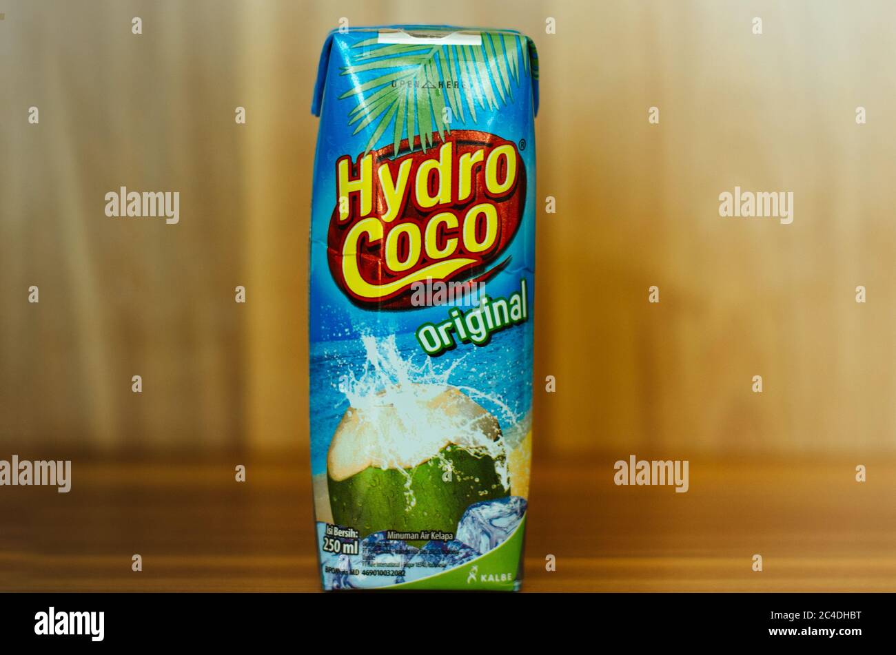 Close up of the Hydro Coco coconut water drink box in a wood background ...