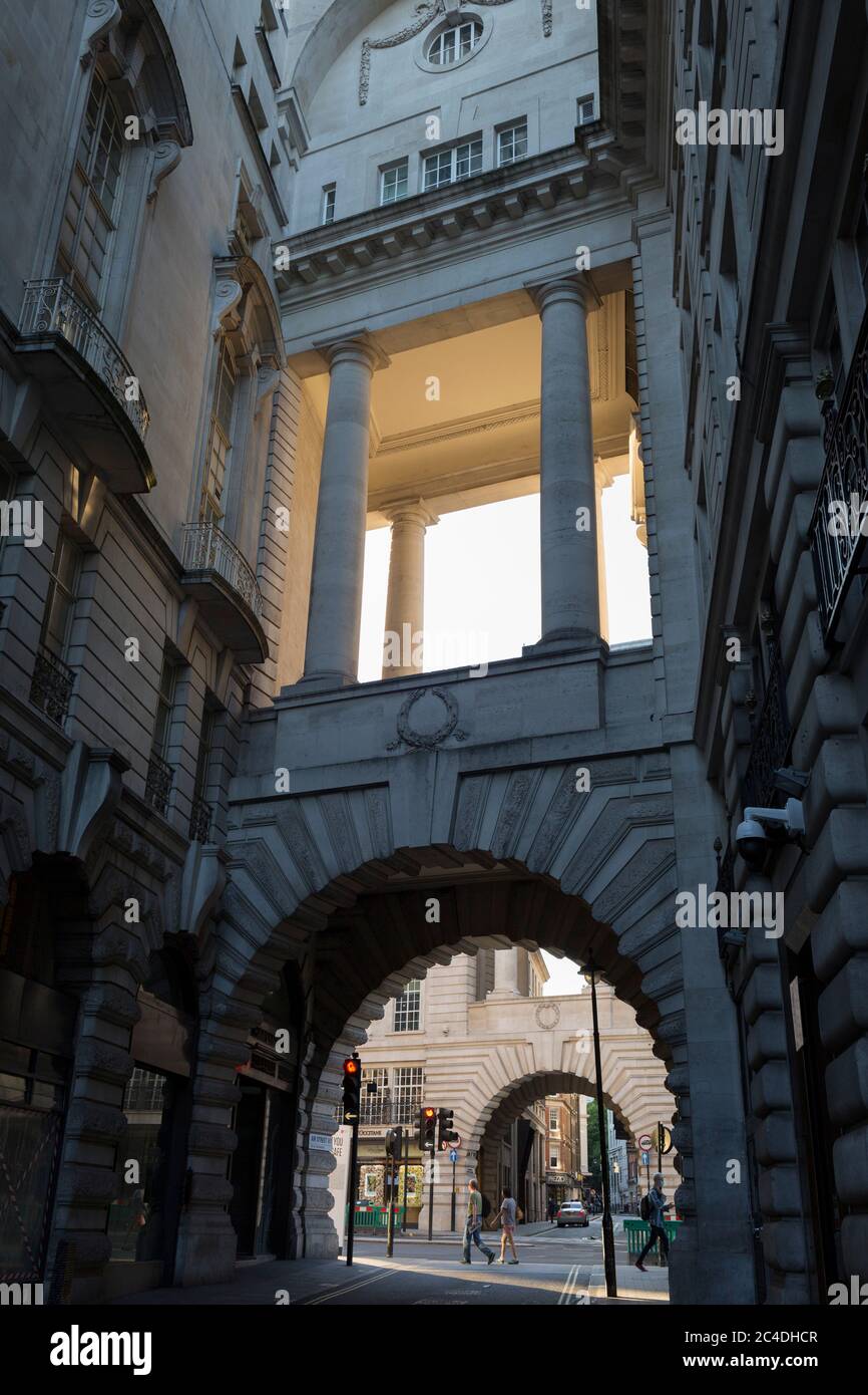 Londoners pass the architecture of the Air Street arch with Regency-era ...
