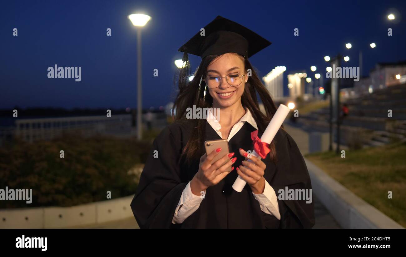 Highschool graduate girl after graduation caremony walking and t Stock ...
