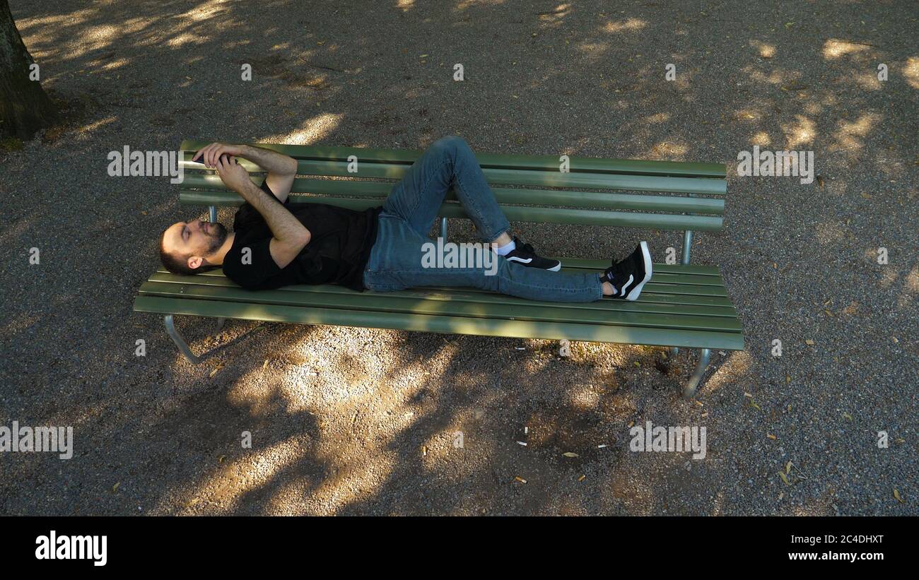 Businessman lying on bench hi-res stock photography and images - Alamy