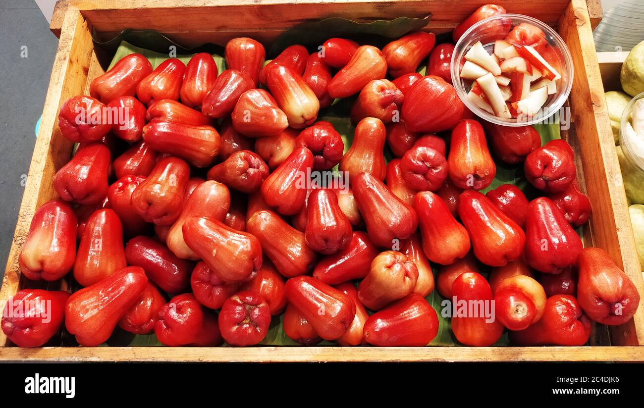Fresh rose apples in wood tray Stock Photo - Alamy