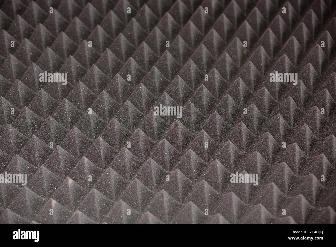 Dark grey diamond-shaped soundproof coating with sharp pyramidal ...