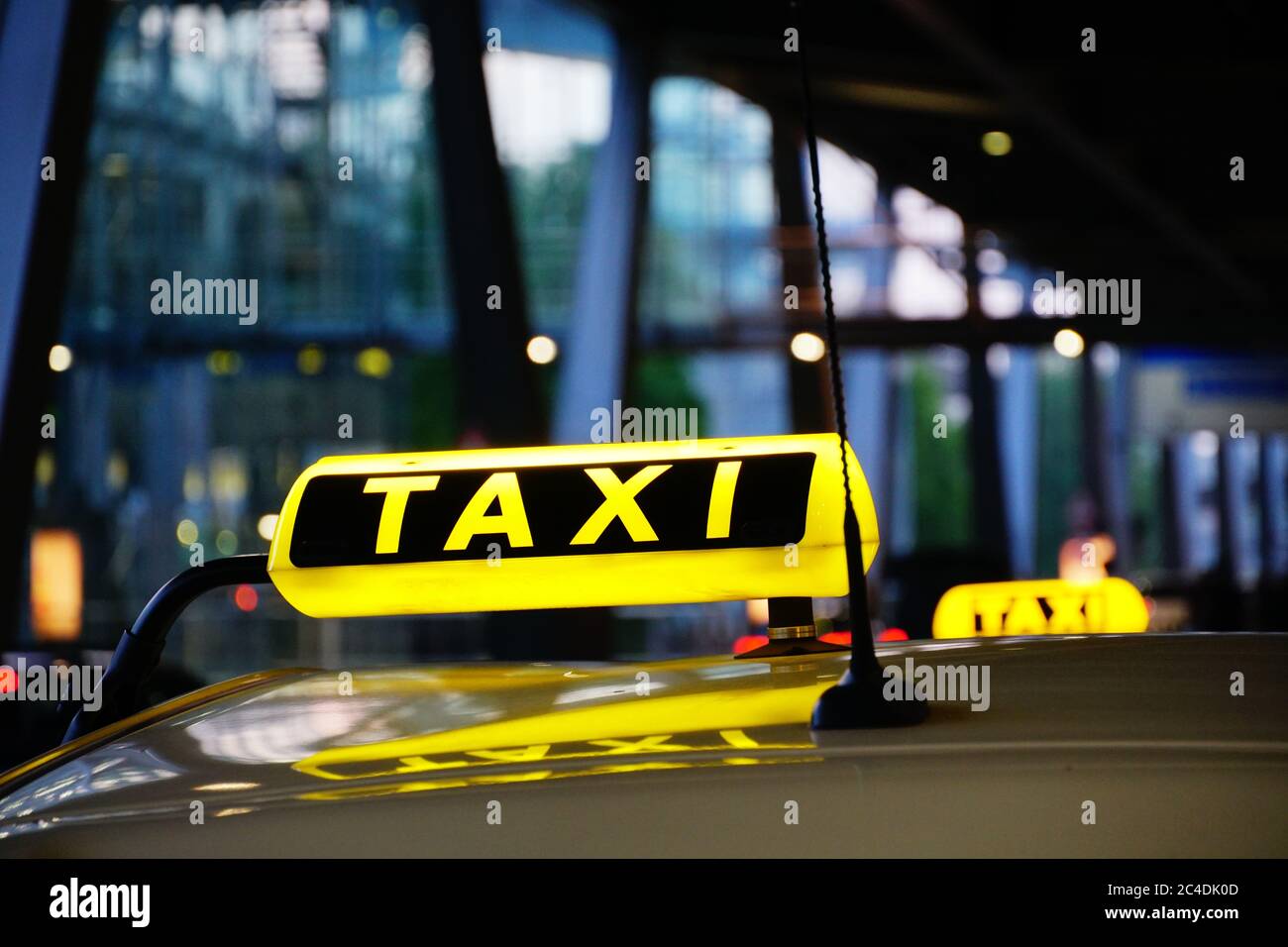 Yellow taxi sign on top of the car Stock Photo - Alamy
