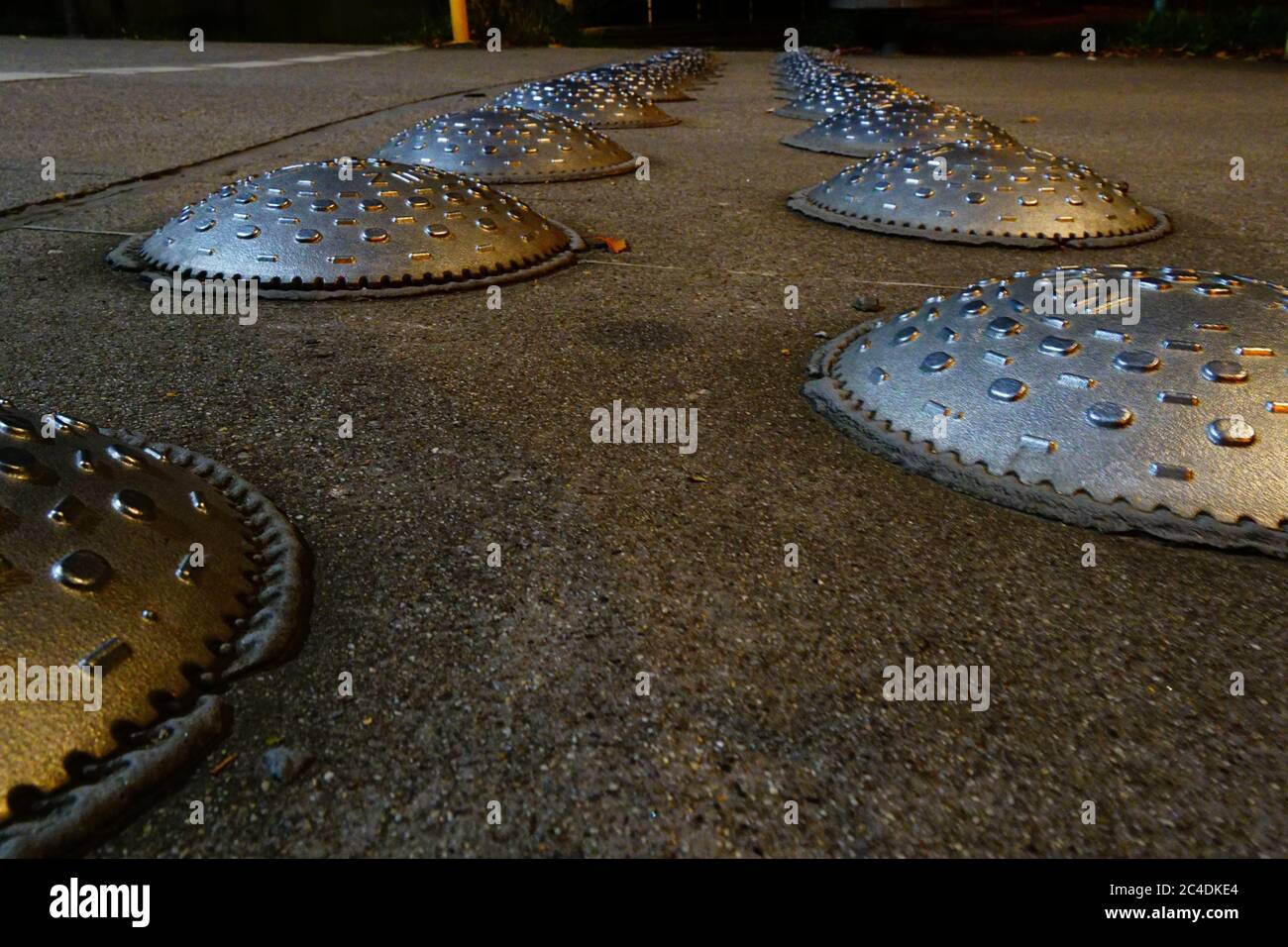Road bumps for reducing the speed of a car Stock Photo - Alamy