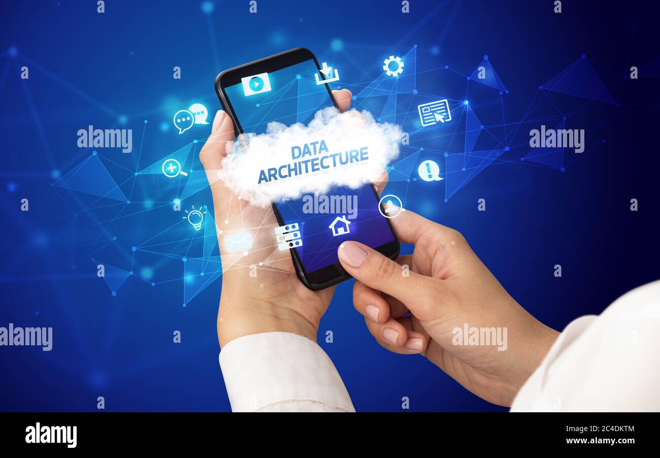 Female hand holding smartphone with DATA ARCHITECTURE inscription ...