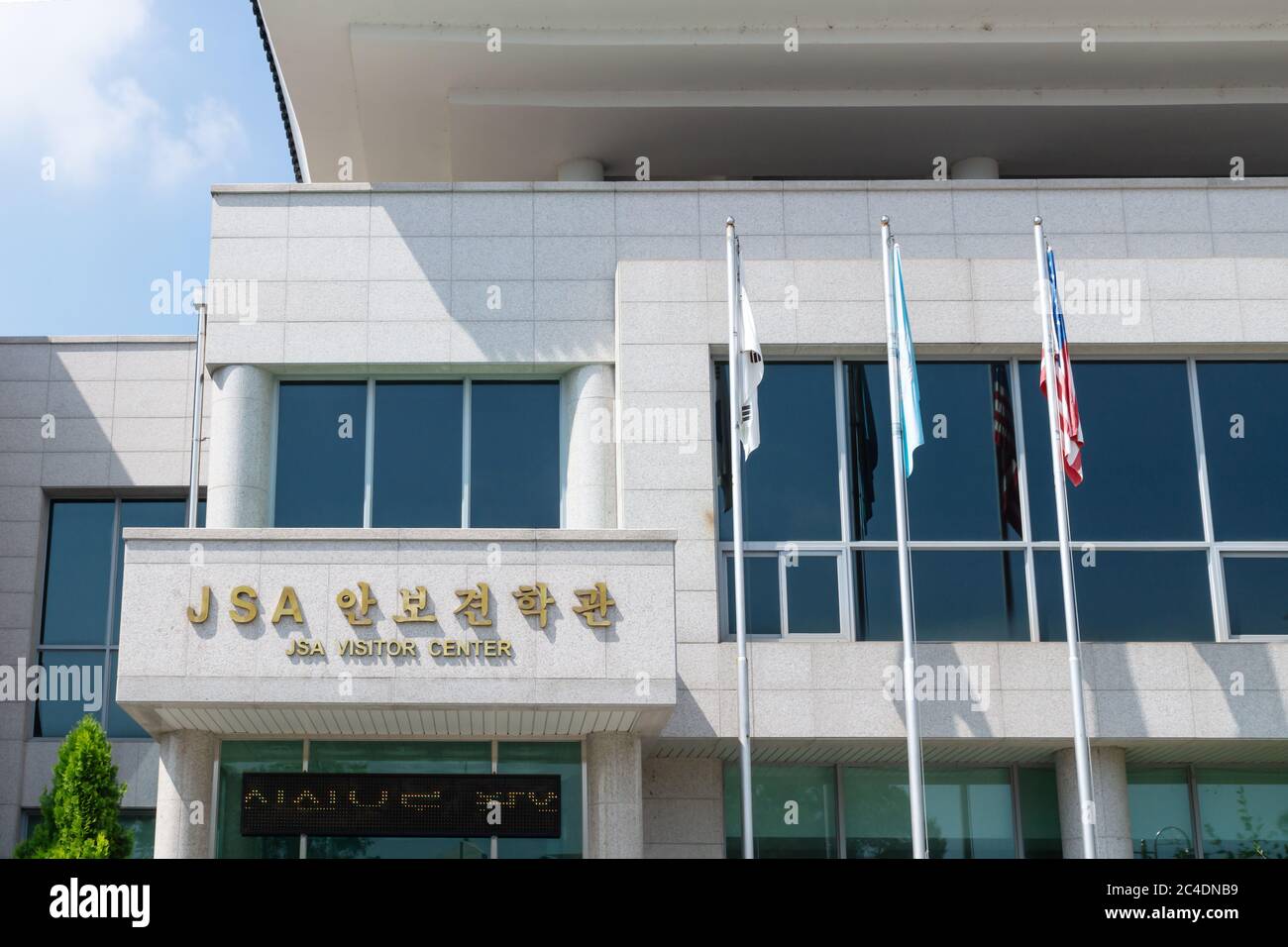 Entrance of the JSA Visitor Center in the border zone DMZ with flags ...