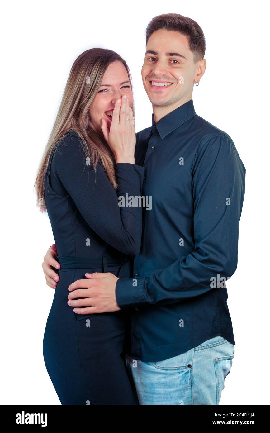 Young couple laughing on a white background Stock Photo - Alamy
