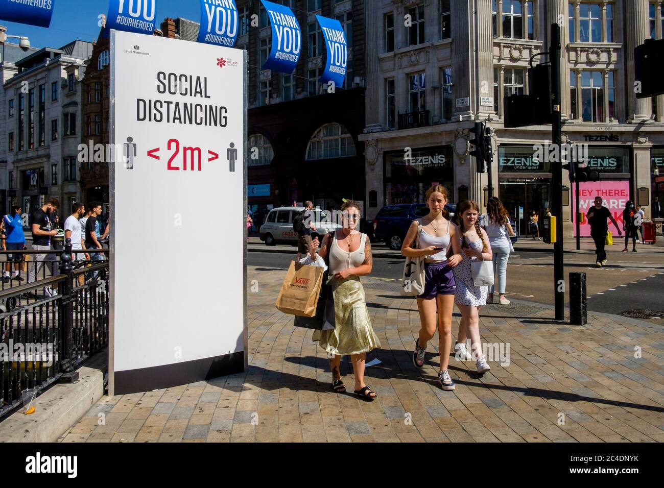 Sign at Oxford Circus reminds pedestrians to adhere to social ...