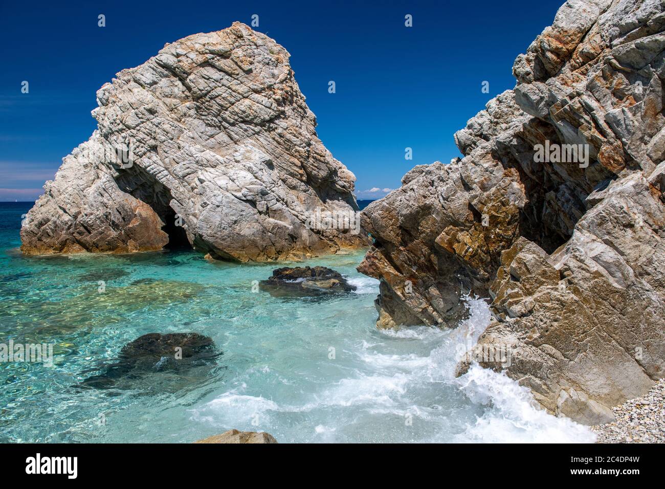 Amazing rocks over the crystal clear waters in Elba Island, Italy ...