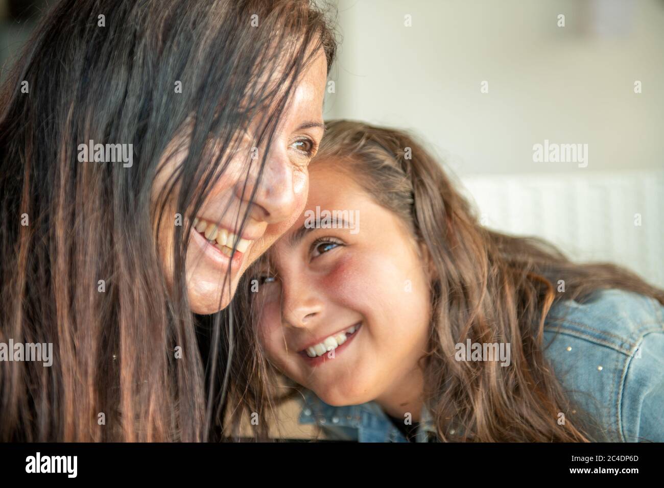 Happy family moments. Smiling intimate mother and daughter Stock Photo ...