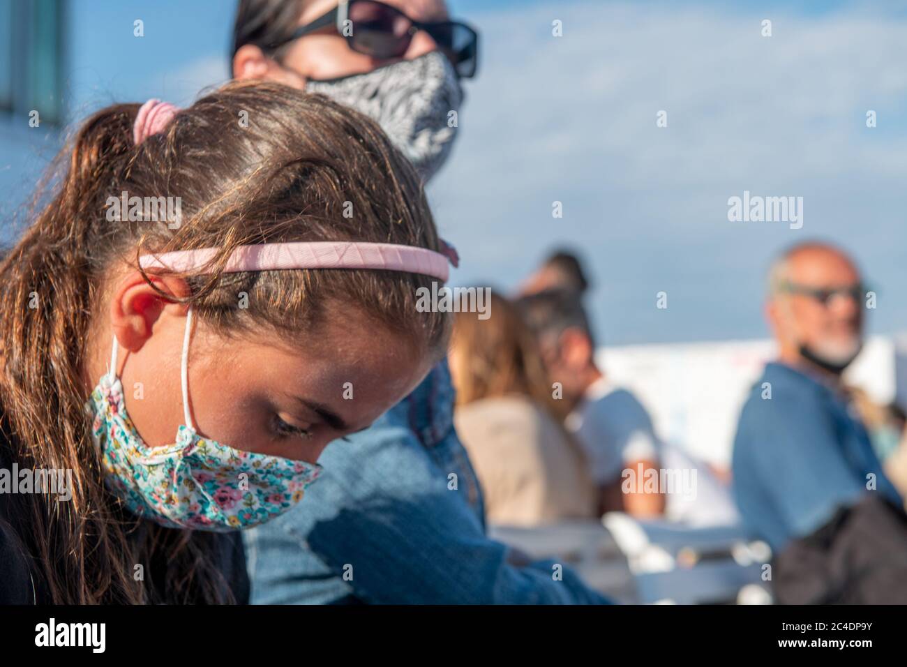 Group of tourists wearing masks on the ferry boat. Covid 19 travel ...
