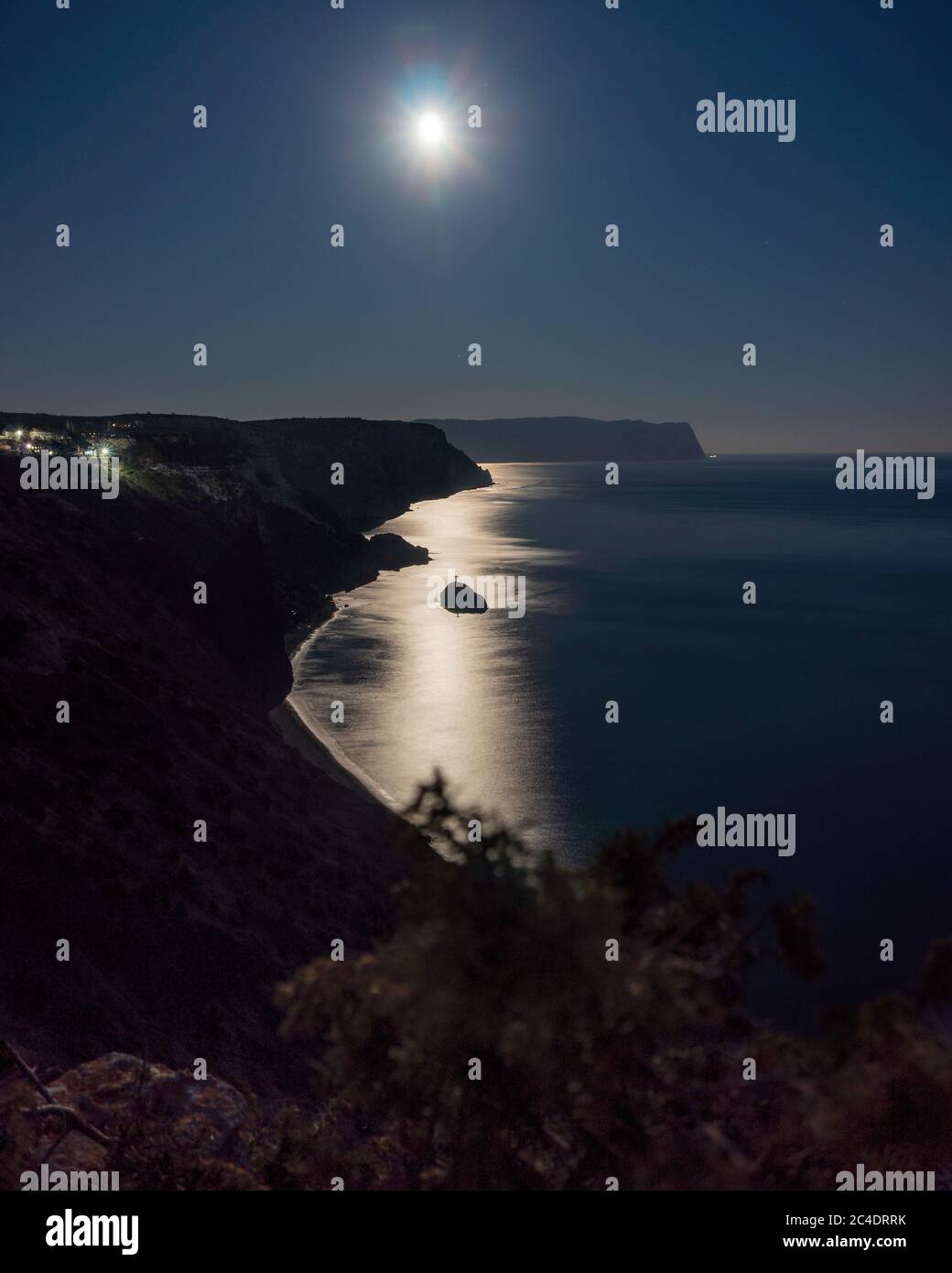 Starry night with a full moon over sea Stock Photo - Alamy