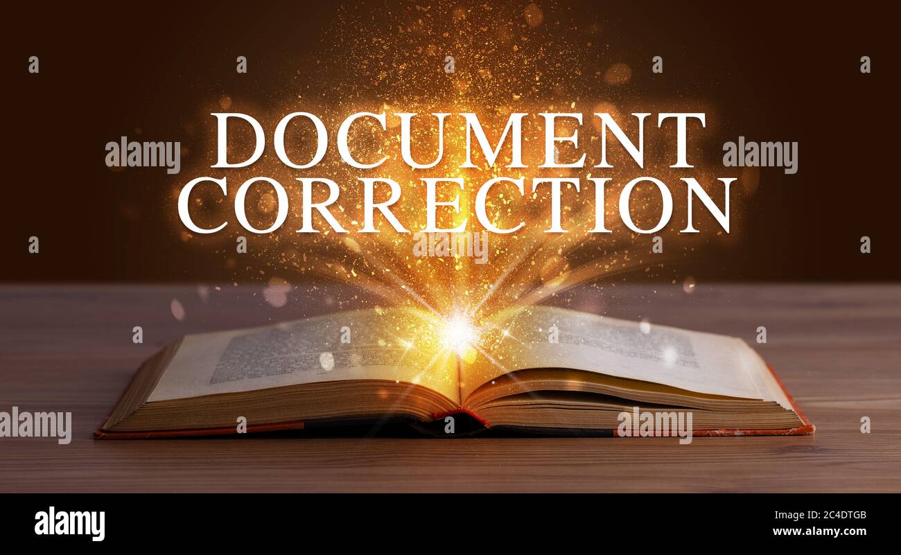 DOCUMENT CORRECTION inscription coming out from an open book ...