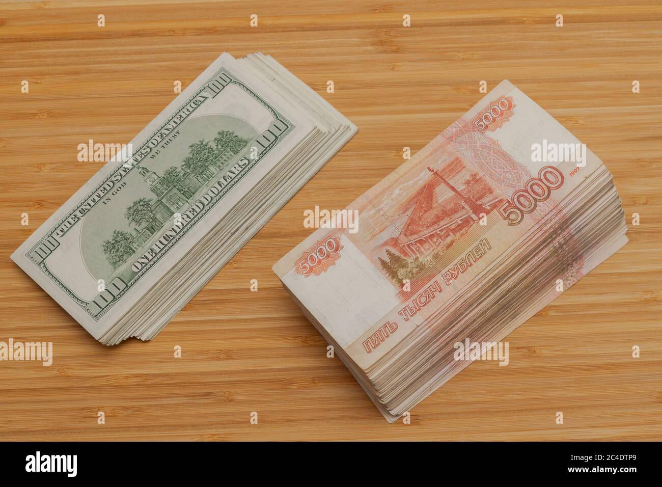 A large number of American hundred dollar bills and Russian five ...