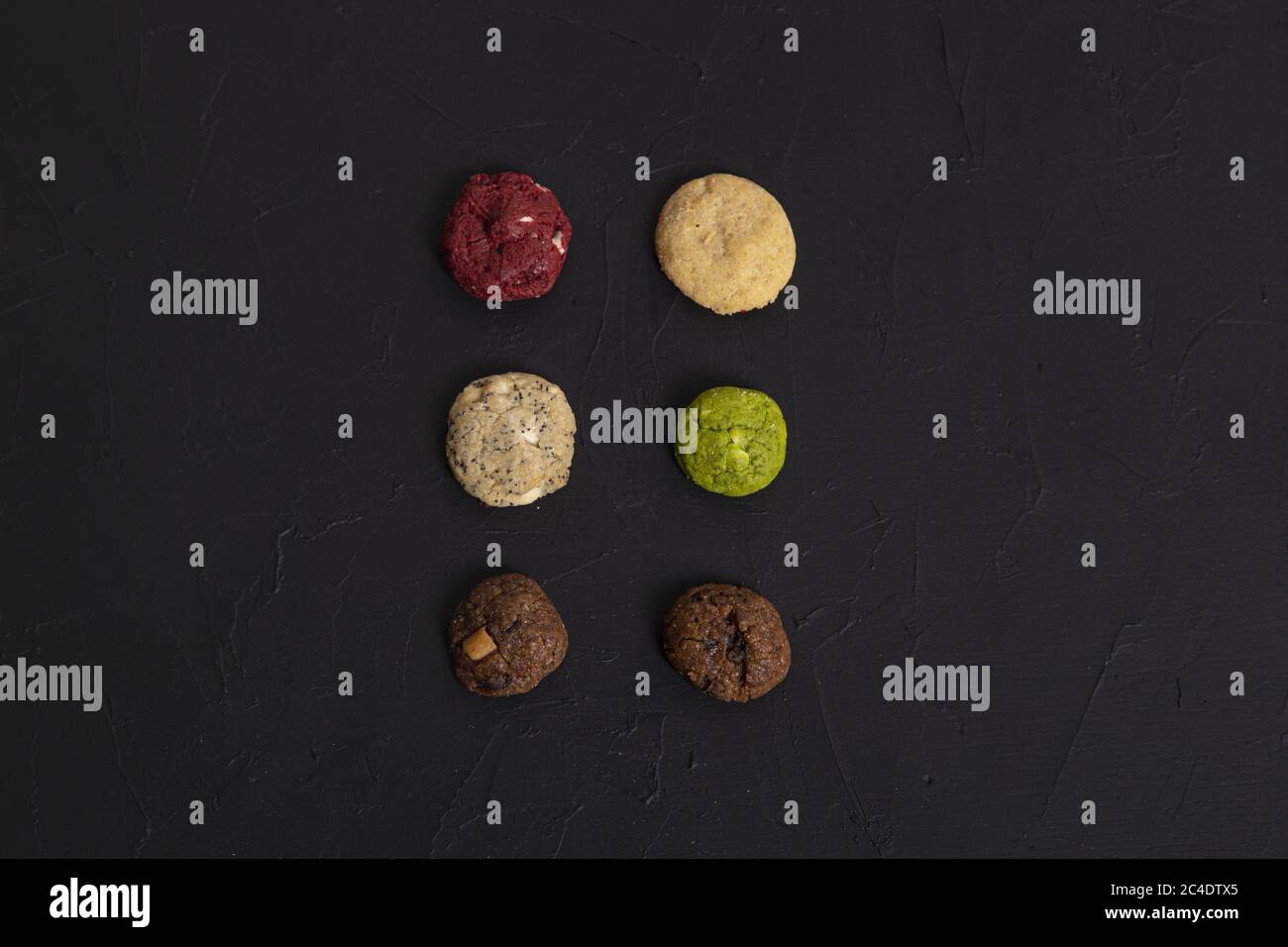 High angle shot of six different cookies on a black rough surface Stock ...