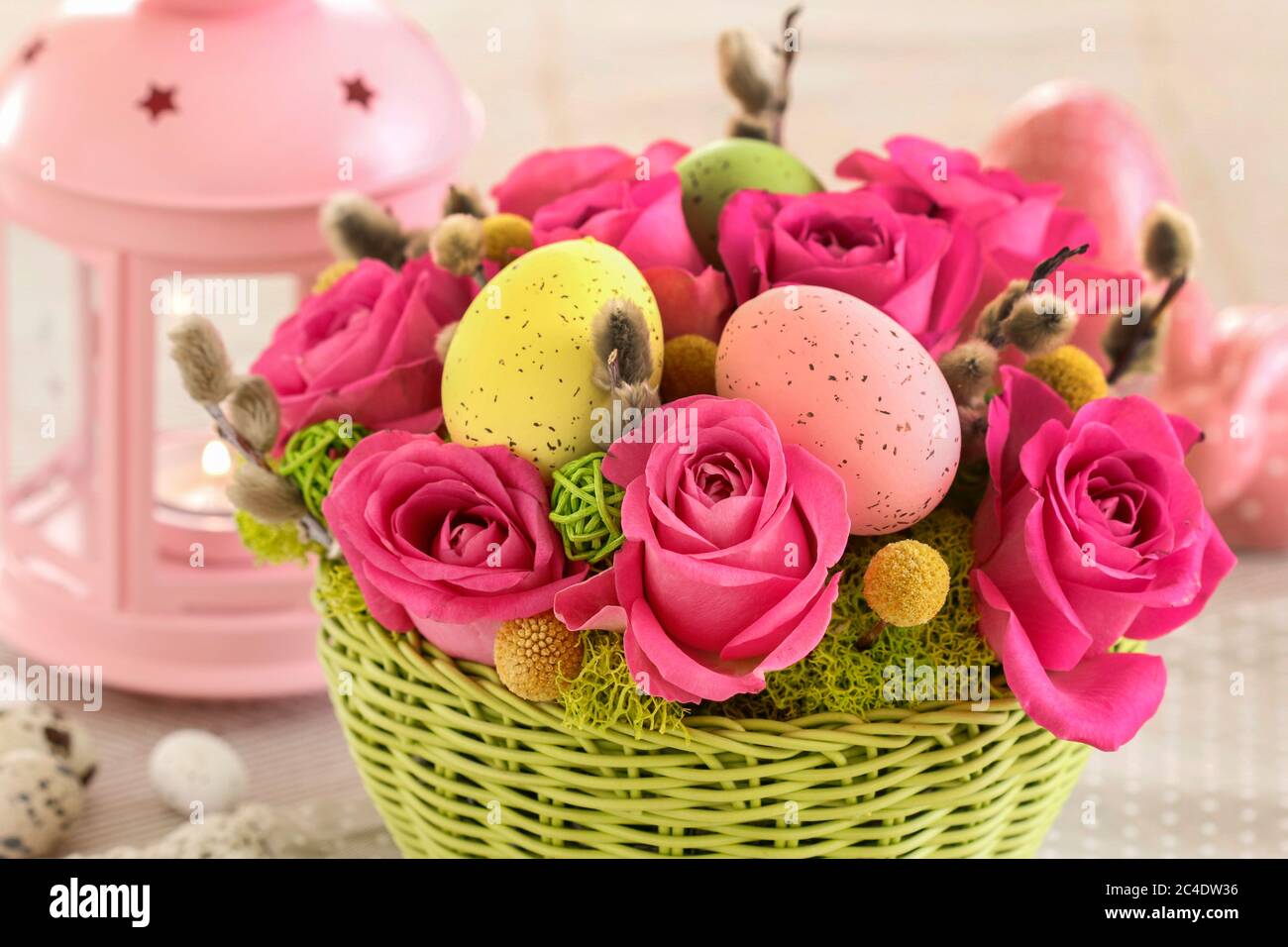 Florist at work: woman shows how to make Easter table decoration with ...