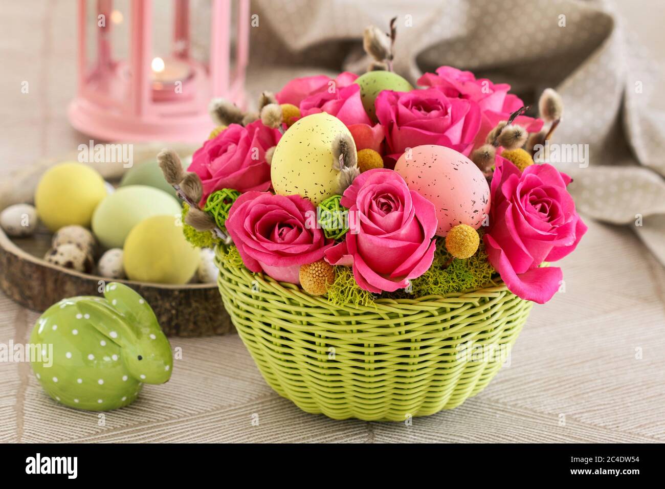 Florist at work: woman shows how to make Easter table decoration with ...