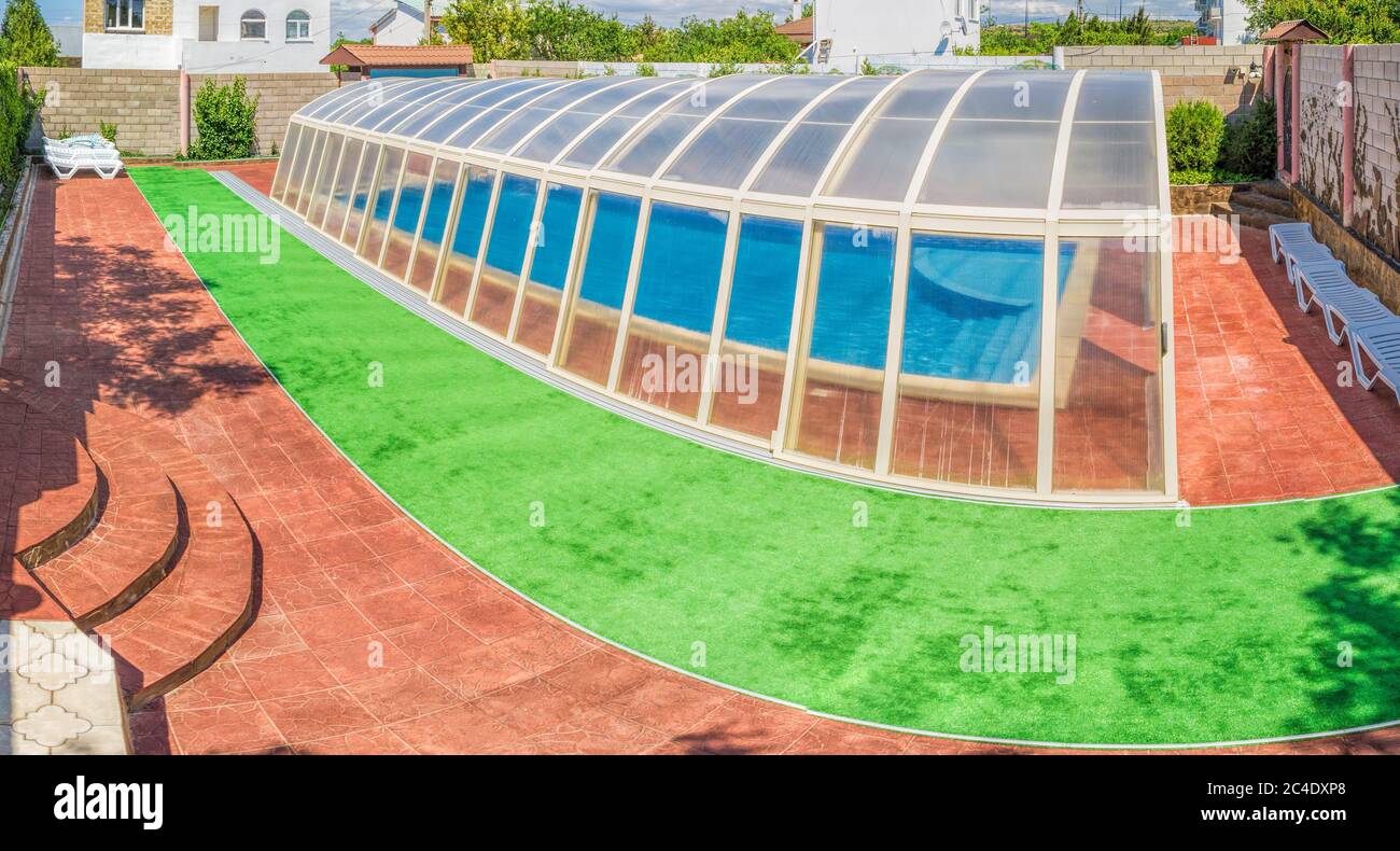 Covered summer pool. The covered area of the outdoor pool for hotel ...