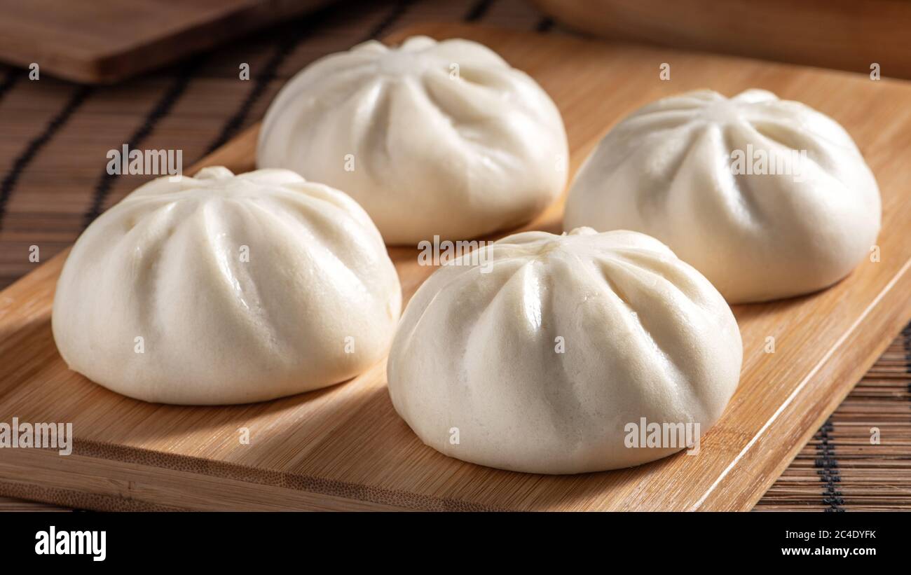 Delicious baozi, Chinese steamed meat bun is ready to eat on serving ...