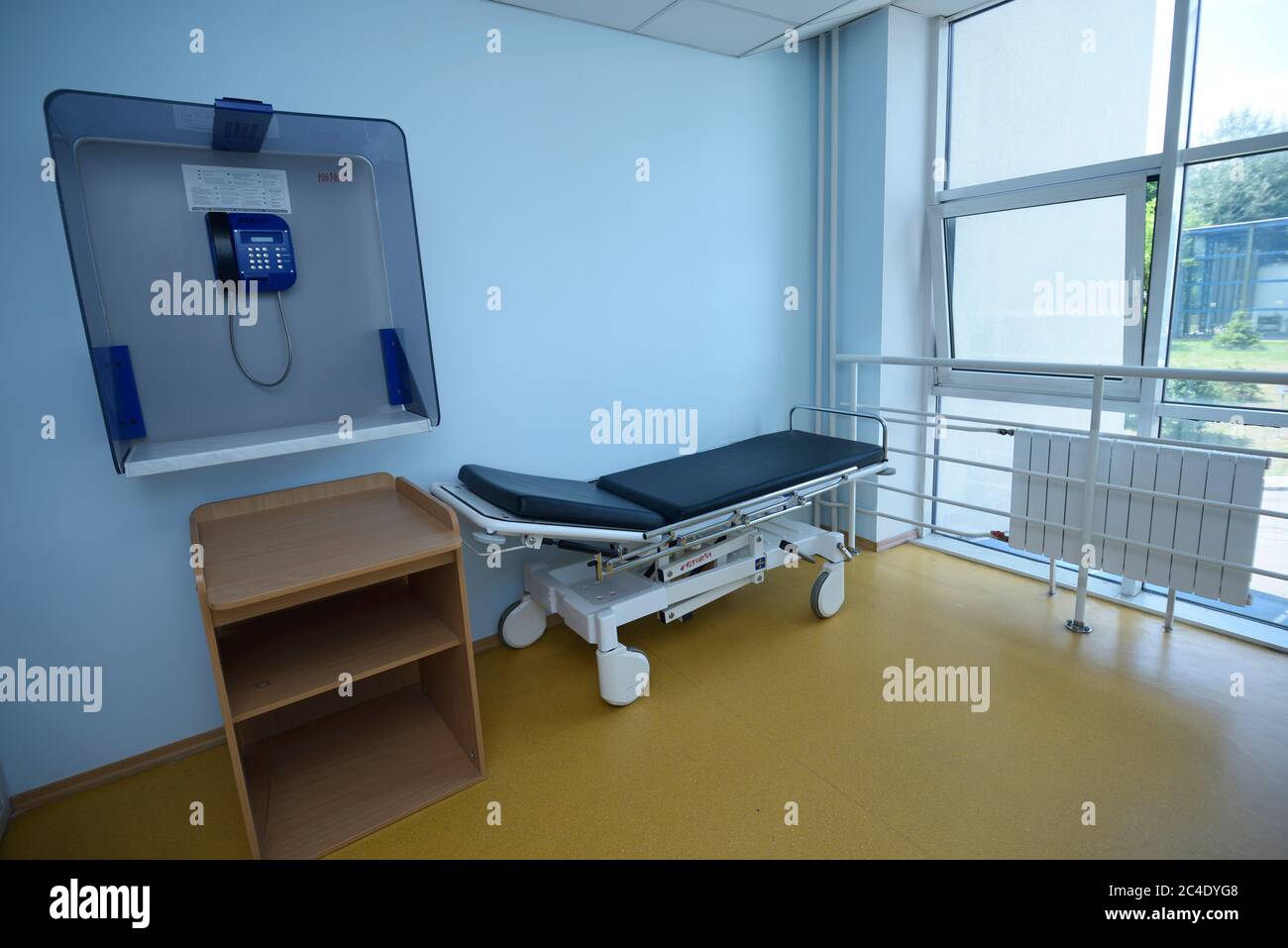 Hospital phoning room for patients: phone, wheelchair and stretcher ...