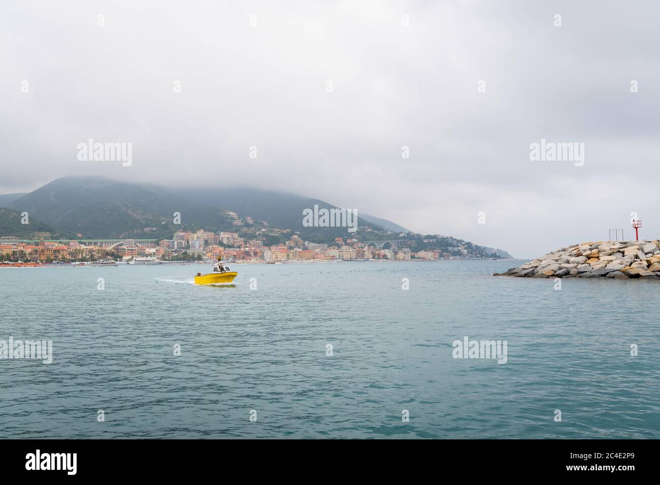 Yellow fishing boat while returning to the port of Varazze, Liguria ...