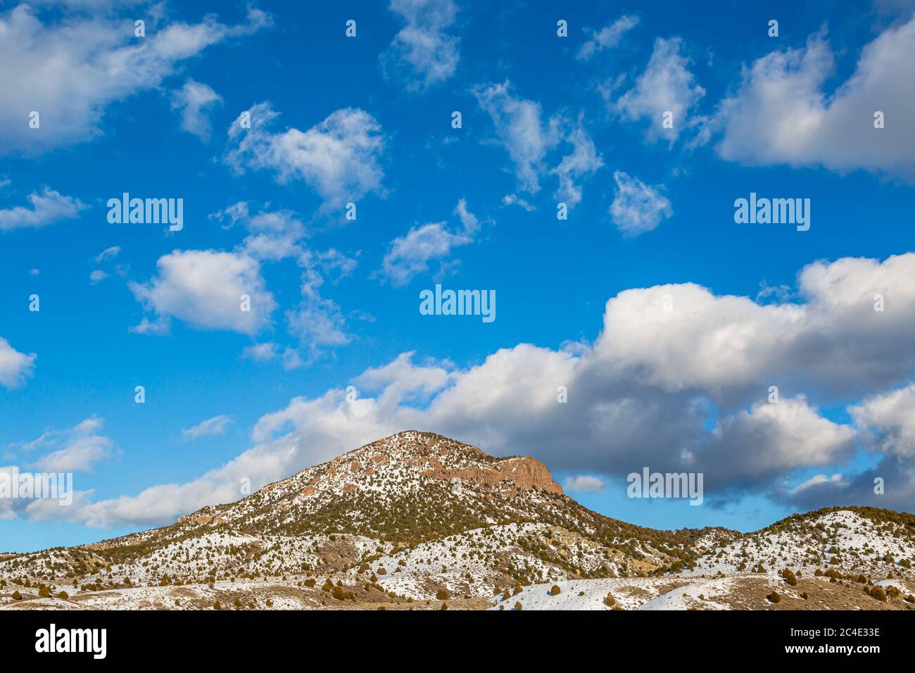 Snowy mountains in Utah with blue sky and clouds overhead Stock Photo ...