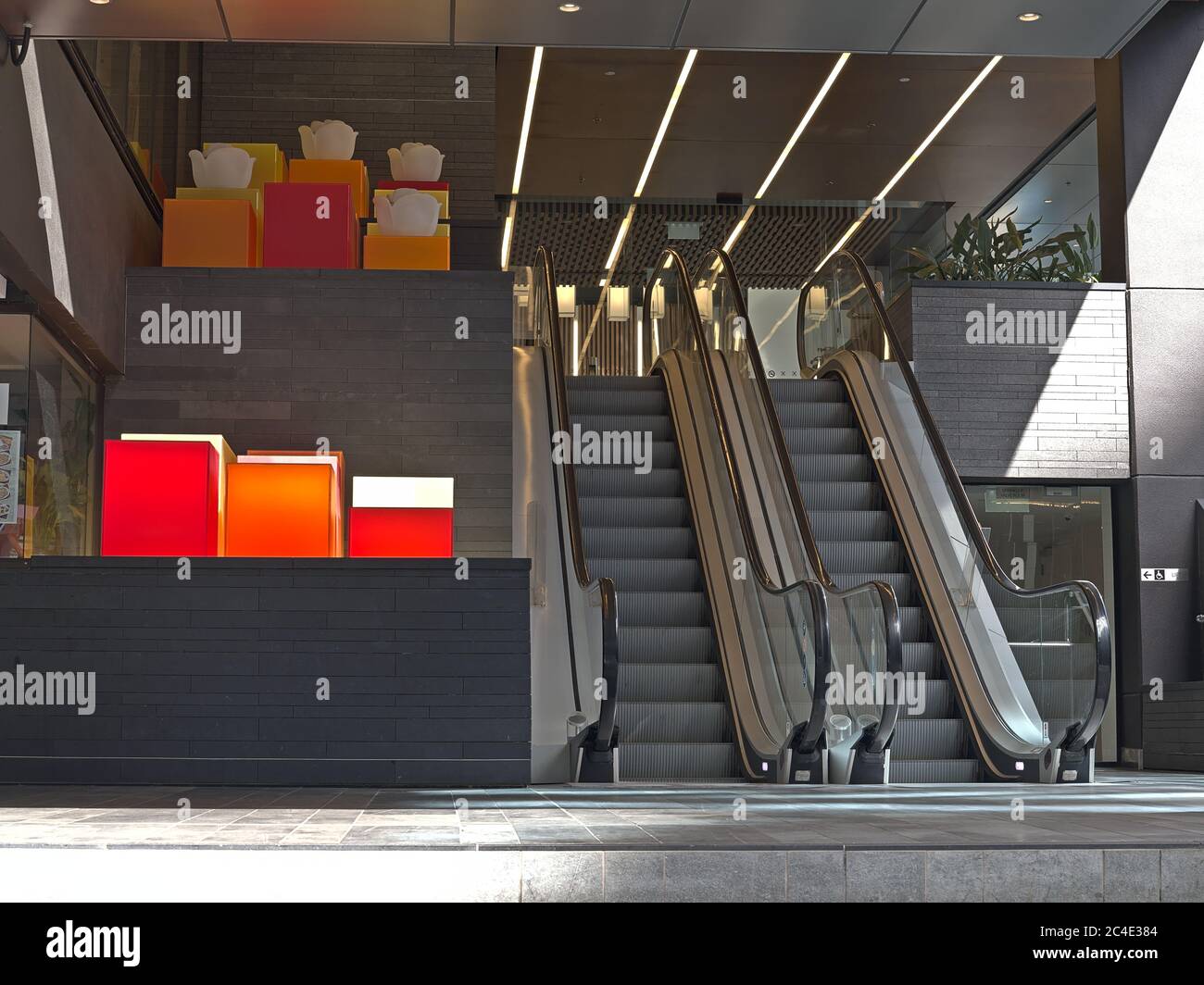 Landscape shot of escalators in a modern dark building Stock Photo - Alamy