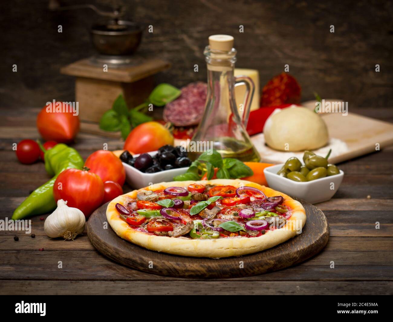 Homemade pizza with ham, cheese and vegetables Stock Photo - Alamy