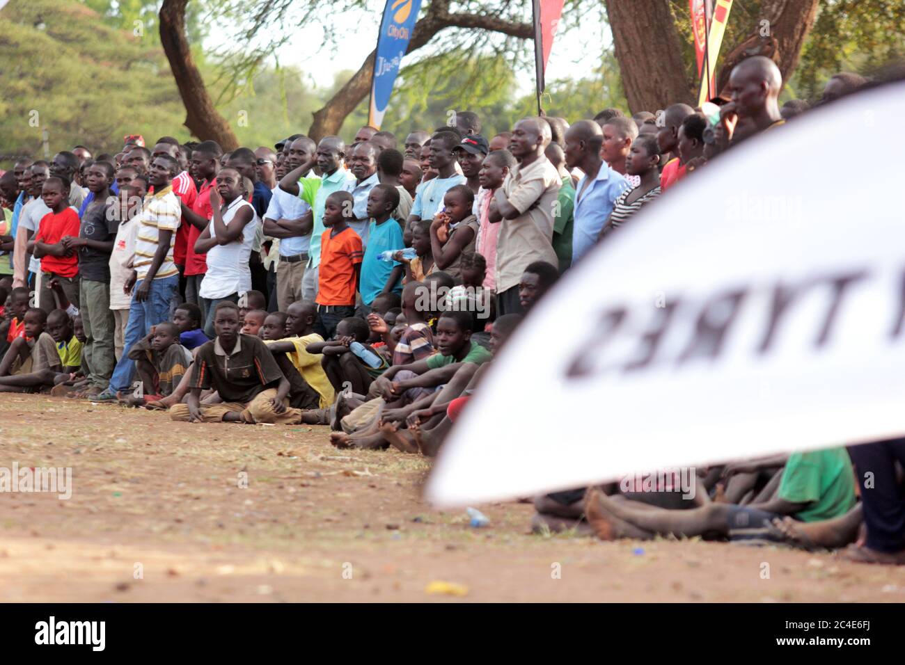 Ardent local fans following a football match involving children in the ...