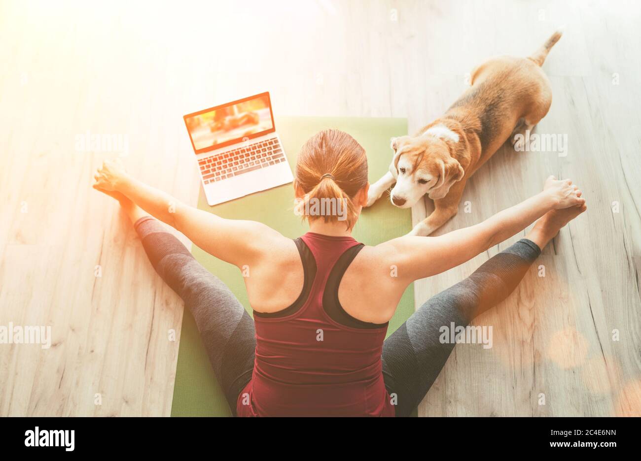 Fit sporty healthy woman sit on mat in Upavistha Konasana pose, doing ...