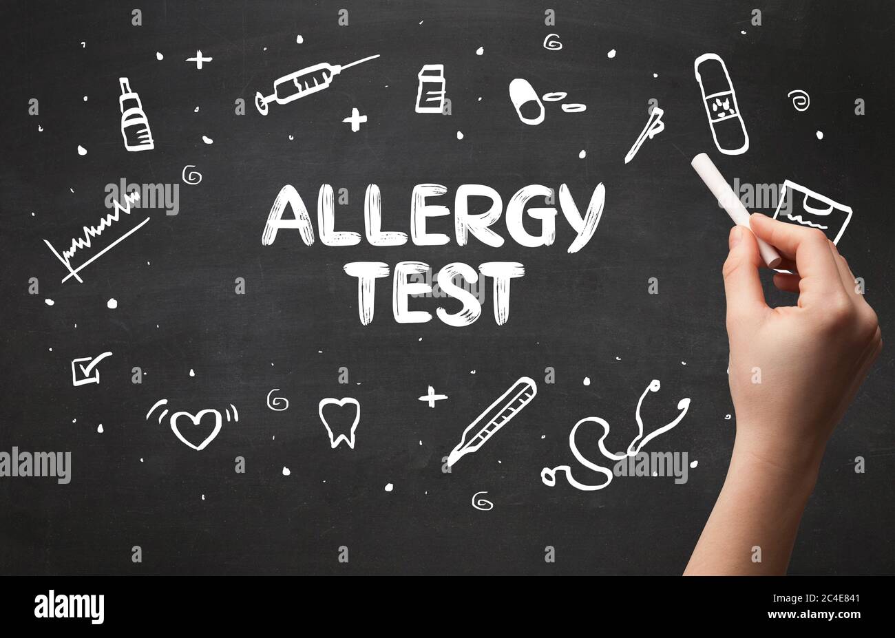 Hand drawing ALLERGY TEST inscription with white chalk on blackboard ...