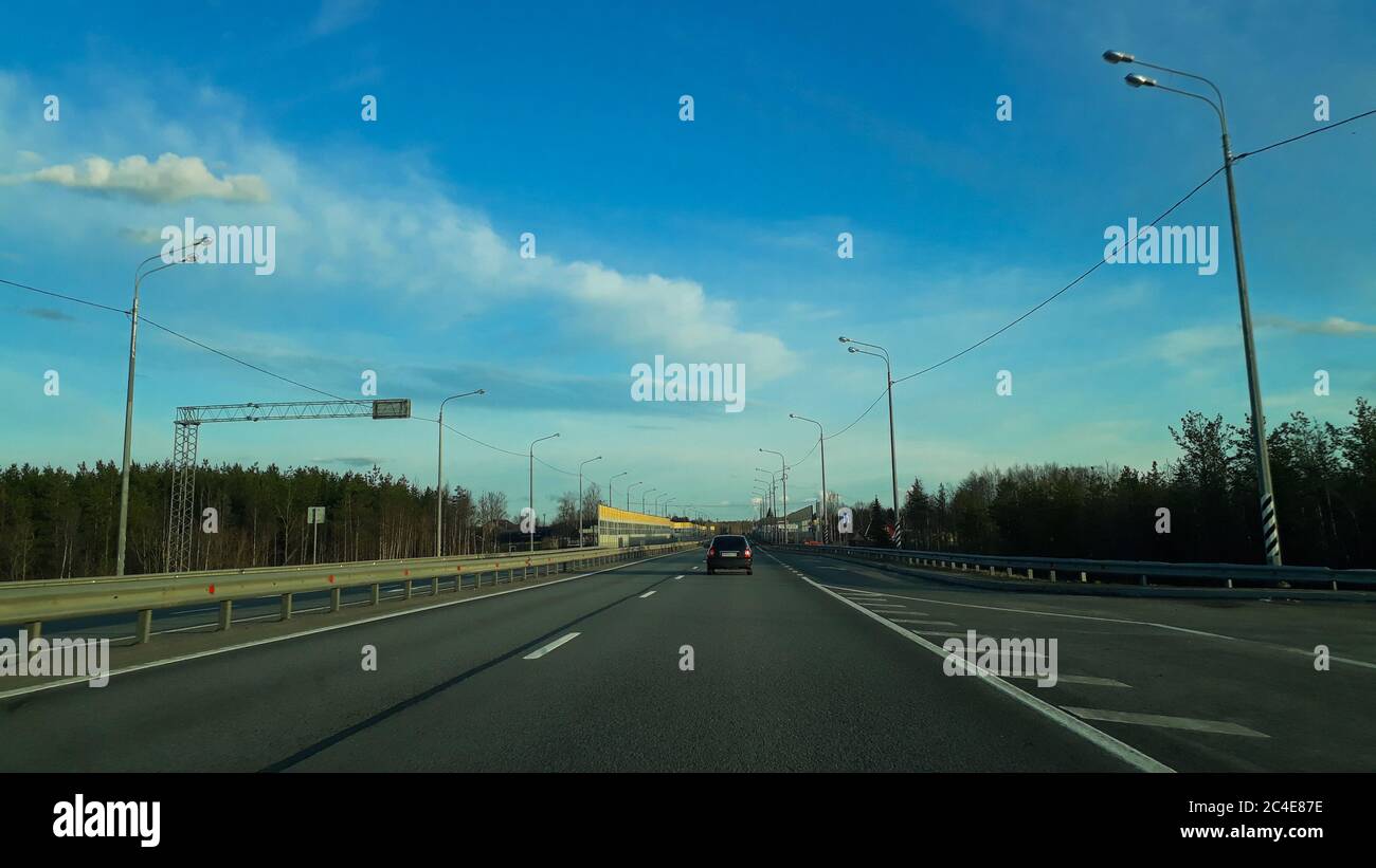 A road or highway leading to the horizon. View from the car window ...