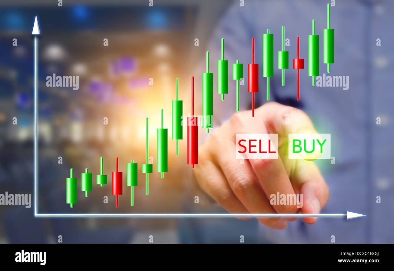 Businessman pressing buy button on virtual screens with stock chart ...