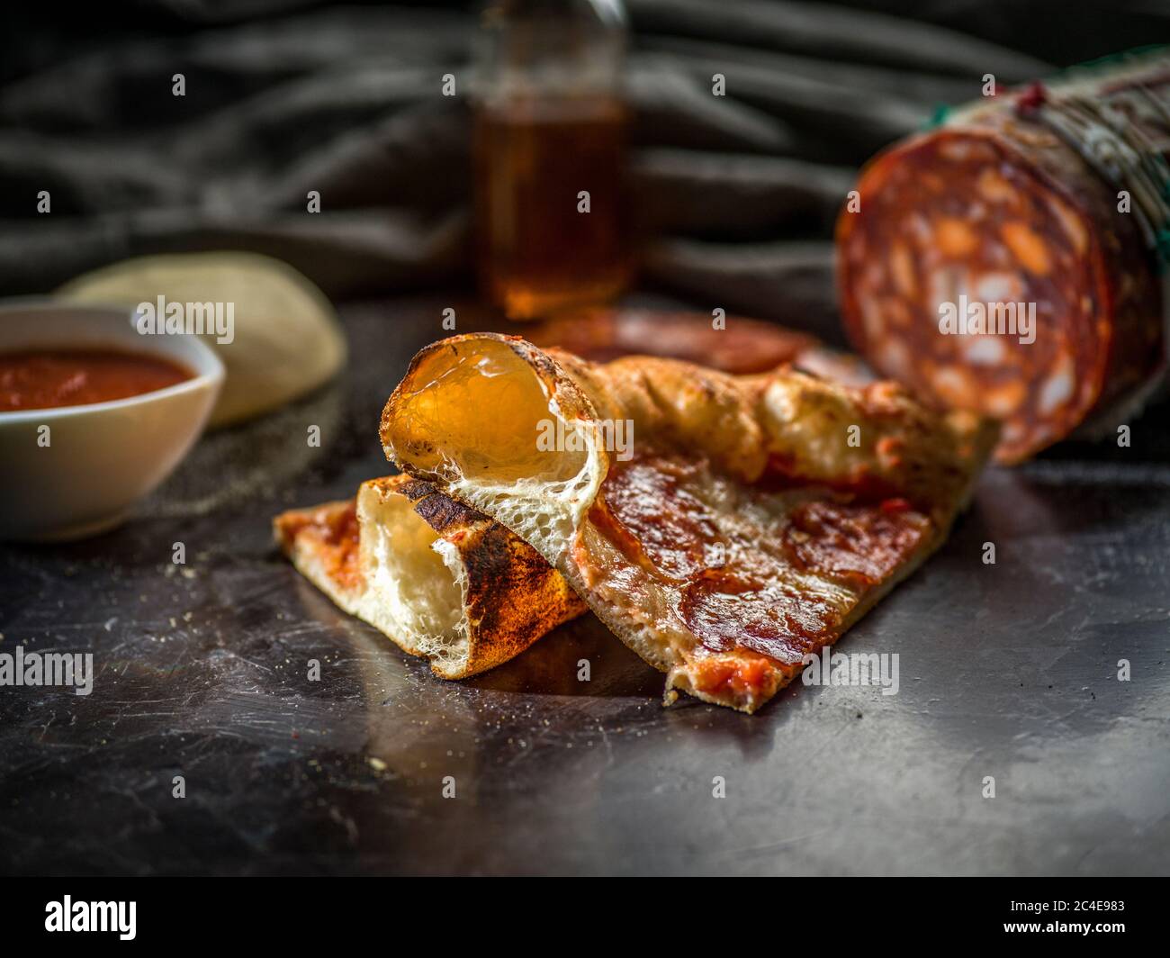 Pizza on a table with ingredients Stock Photo - Alamy