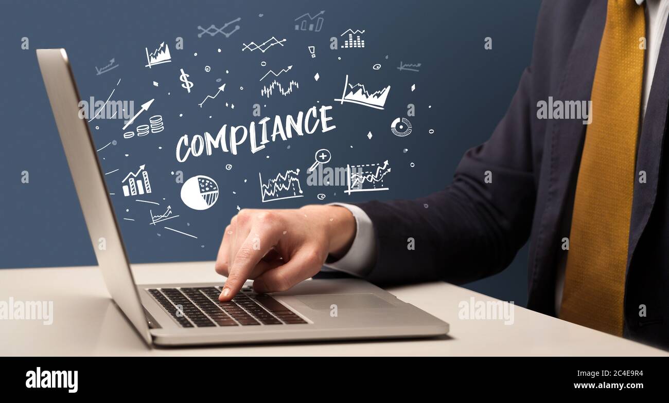 Businessman working on laptop with COMPLIANCE inscription, modern ...