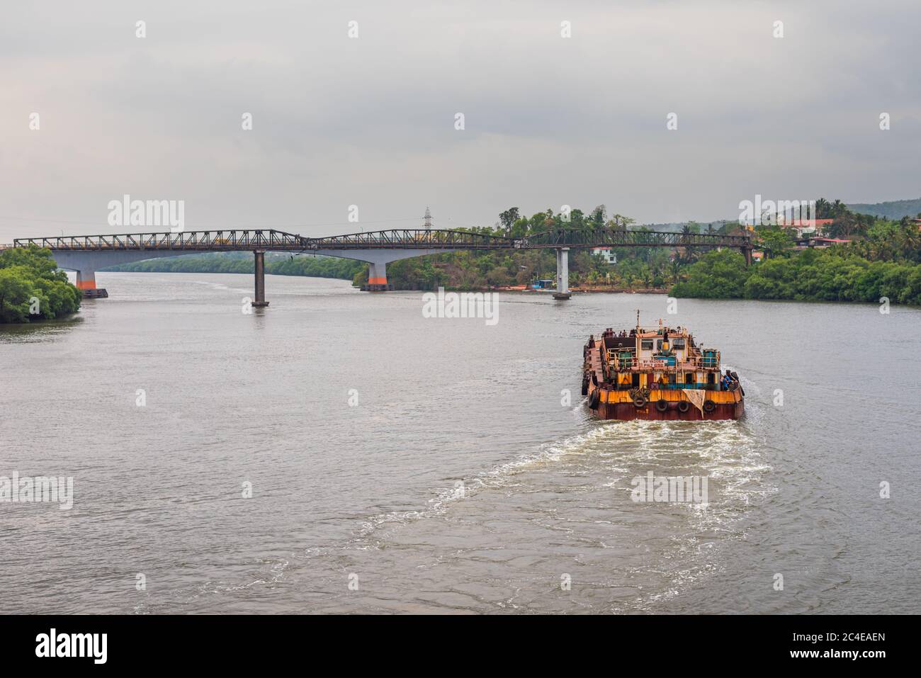 SOUTH GOA, INDIA - May 05, 2020: Barges carrying mining ore for export ...