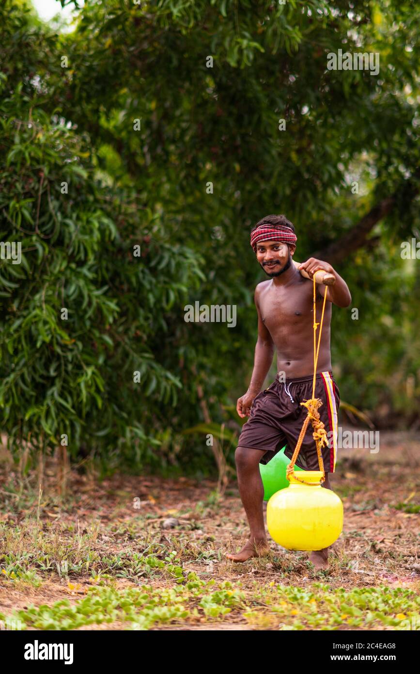 SOUTH GOA, INDIA - May 05, 2020: Barges carrying mining ore for export ...