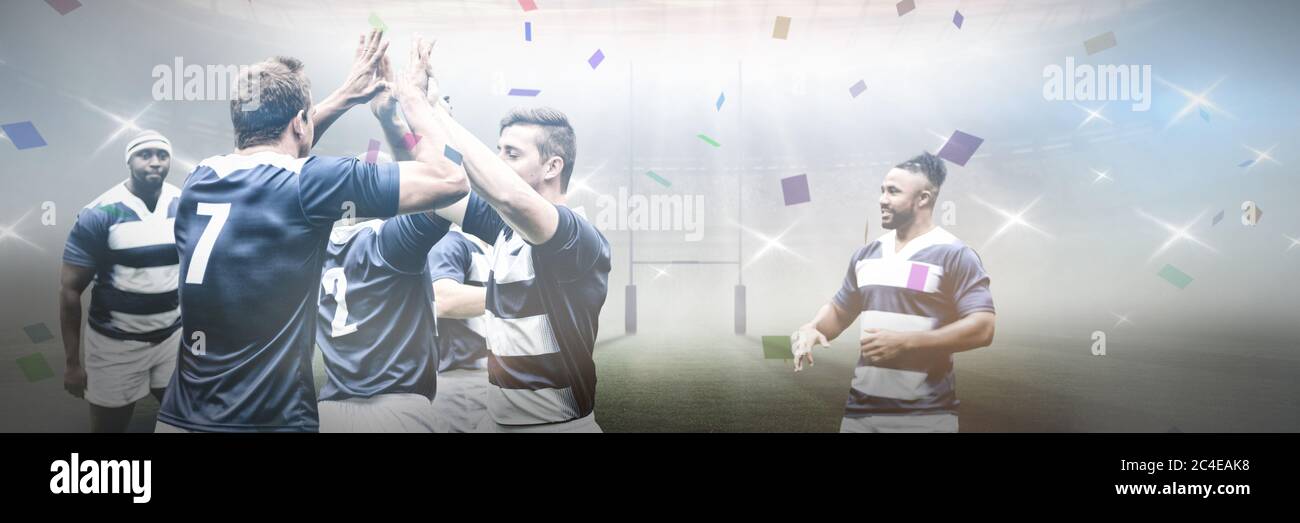 Digital composite image of team of rugby players celebrating a win in ...