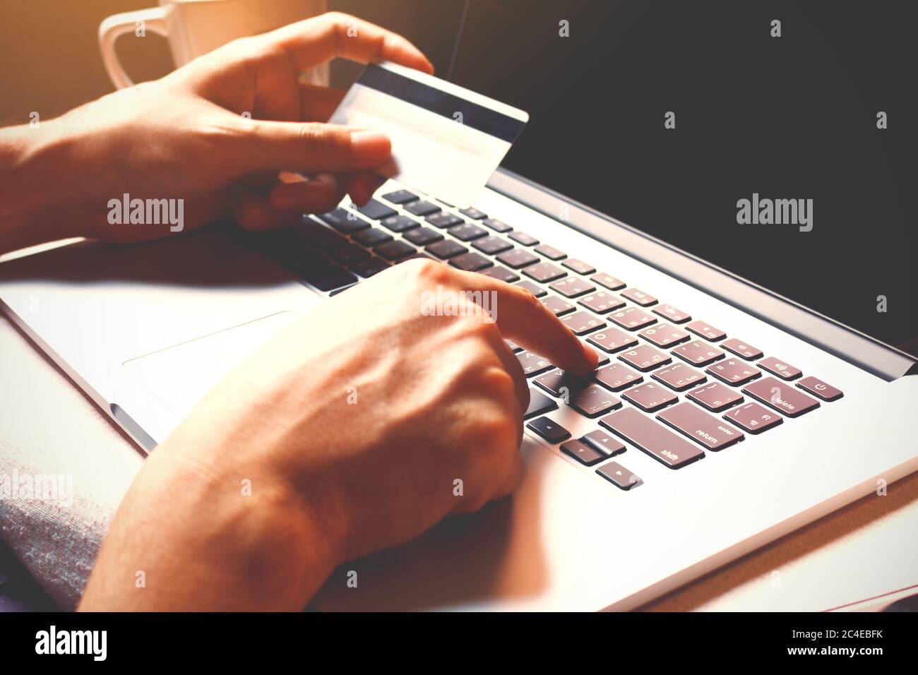 Man hand holding debit card for shopping online Stock Photo - Alamy