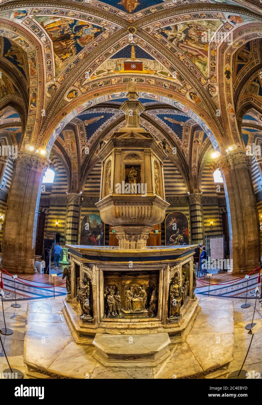 Baptistery ceiling frescoes and baptismal font. Siena Cathedral. Italy ...