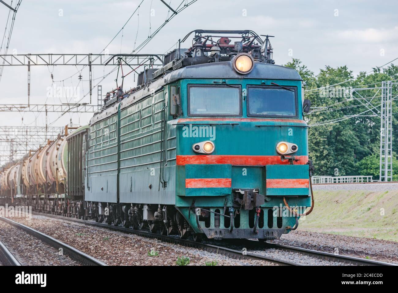 Freight train with oil approaches to the station Stock Photo - Alamy